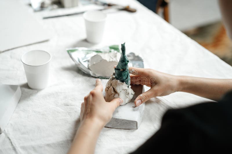 Female Hands Make Plastic and Plaster Molds in Class. Work on the ...