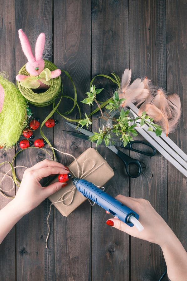 Female Hands Making a Small Gift Wrapped with Paper Stock Photo - Image ...