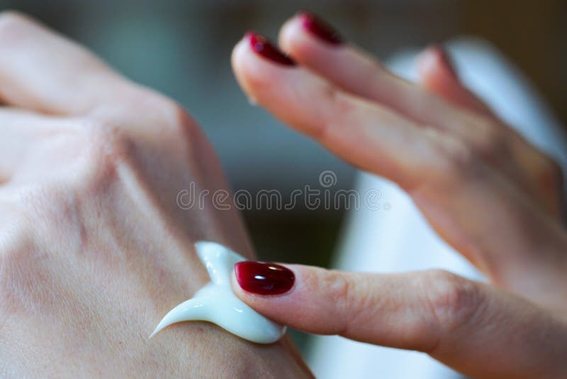 Female Hands with Manicure Moisturizing Hands with Cream on Hand Stock ...