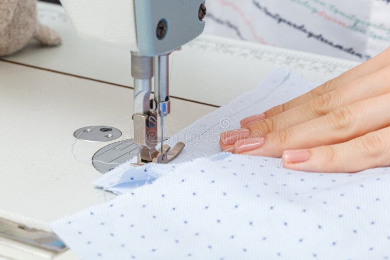 Female Hands of a Master Tailor at Work, a Sewing Machine Needle Stock ...