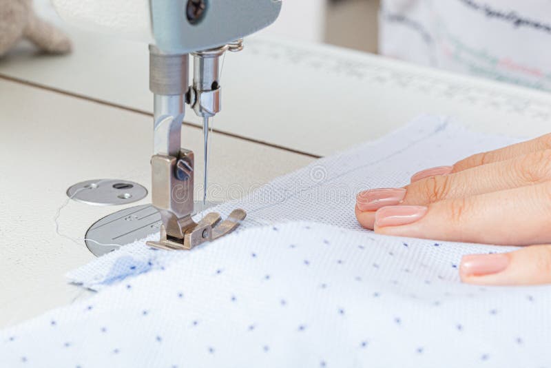 Female Hands of a Master Tailor at Work, a Sewing Machine Needle Stock ...