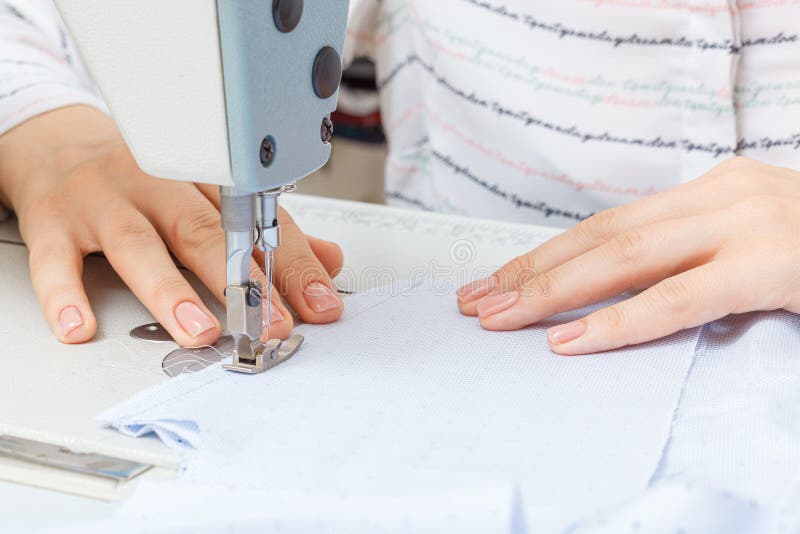 Female Hands of a Master Tailor at Work, a Sewing Machine Needle Stock ...