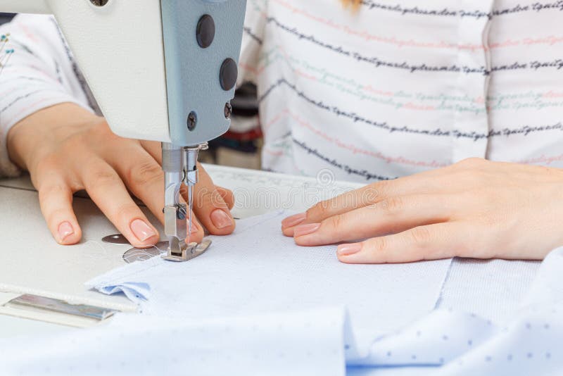 Female Hands of a Master Tailor at Work, a Sewing Machine Needle Stock ...
