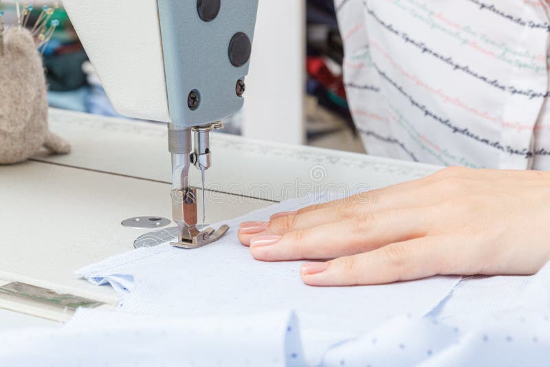 Female Hands of a Master Tailor at Work, a Sewing Machine Needle Stock ...