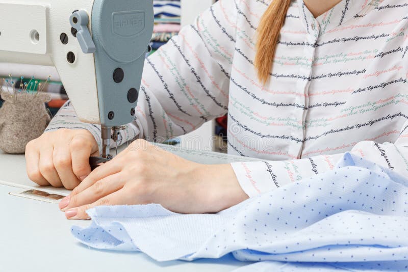 Female Hands of a Master Tailor at Work, a Sewing Machine Needle Stock ...
