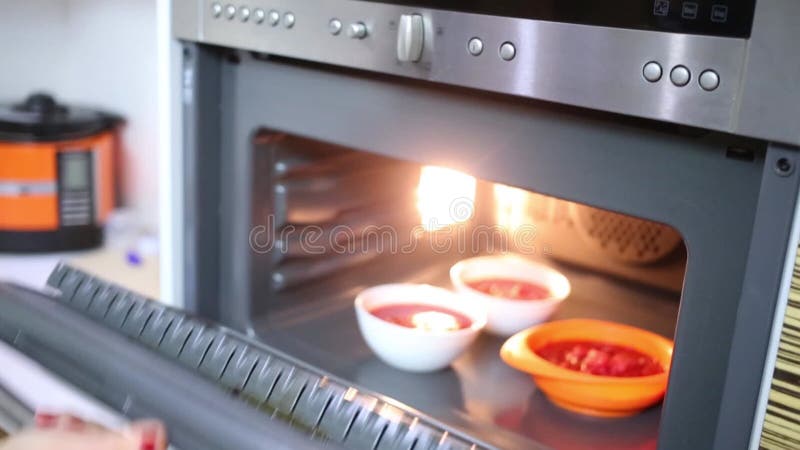 Female Hands Open Oven and Take Out Plates of Stock Video - Video of ...