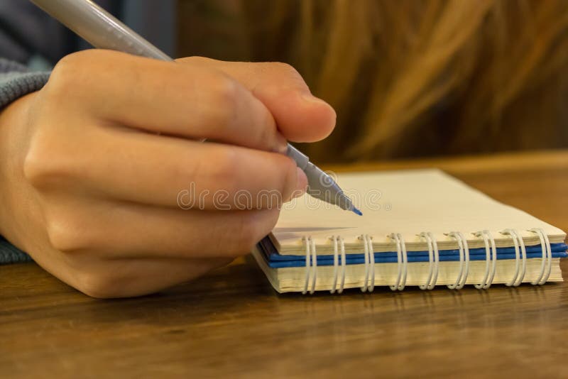 Female Hands with Pen Writing on Notebook Stock Photo - Image of ...