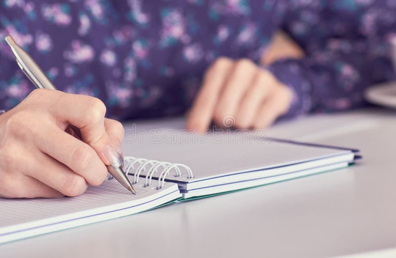 Female Hands with Pen Writing on Notebook at White Office Table. Stock ...