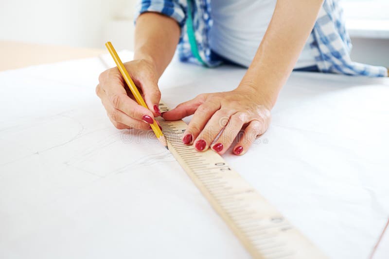 Female Hands with Pencil and Ruler Stock Photo - Image of sewing ...