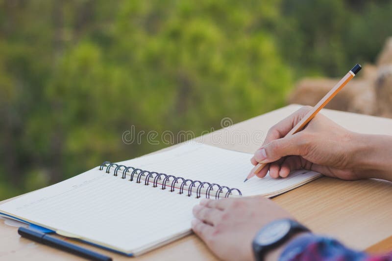 Female Hands with Pencil Writing on Notebook Stock Image - Image of ...