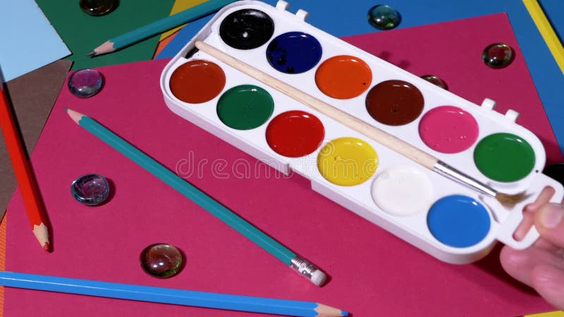 Female Hands Putting a Palette of Watercolors on the Table for Drawing ...