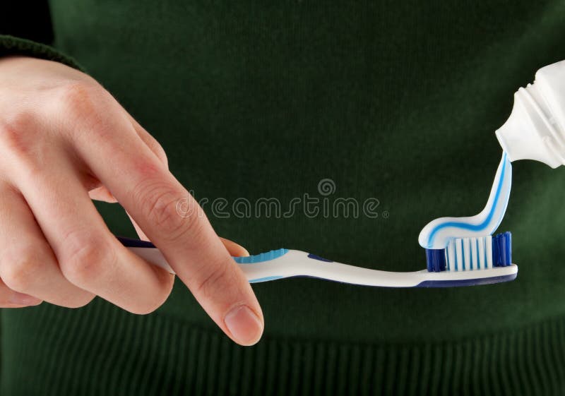 Female Hands Putting Toothpaste on the Toothbrush Stock Image - Image ...