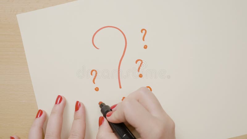 Female Hands with Red Nails Drawing Many Question Marks on a White ...