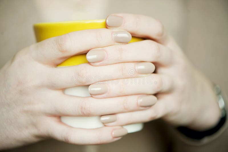 Female Hands with Soft Beige Manicure Stock Image - Image of yellow ...