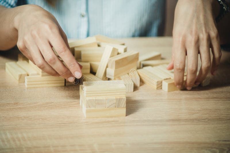 Female Hands Stack of Wooden Bricks Close Up Stock Image - Image of ...