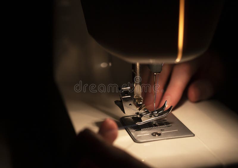 Female Hands of Tailor or Needlewoman Insert Thread into Needle in ...
