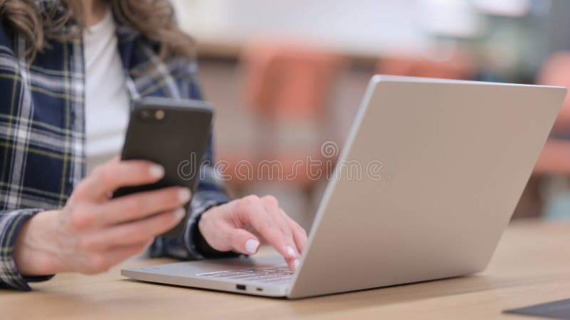 Female Hands Using Smartphone while Typing on Laptop Stock Image ... Female Hands Using Smartphone while Typing on Laptop Stock Image ...