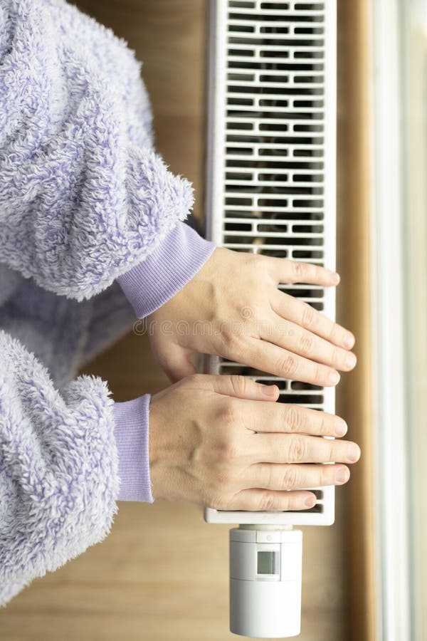 Hands are Warming Themselves Near the Radiator Stock Photo - Image of ...