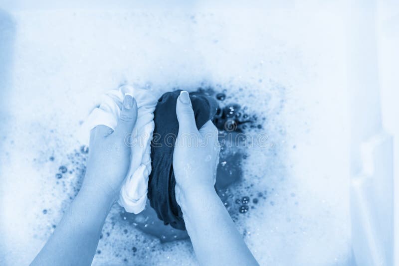 Female Hands Washing Black and White Clothes Together Stock Photo ...