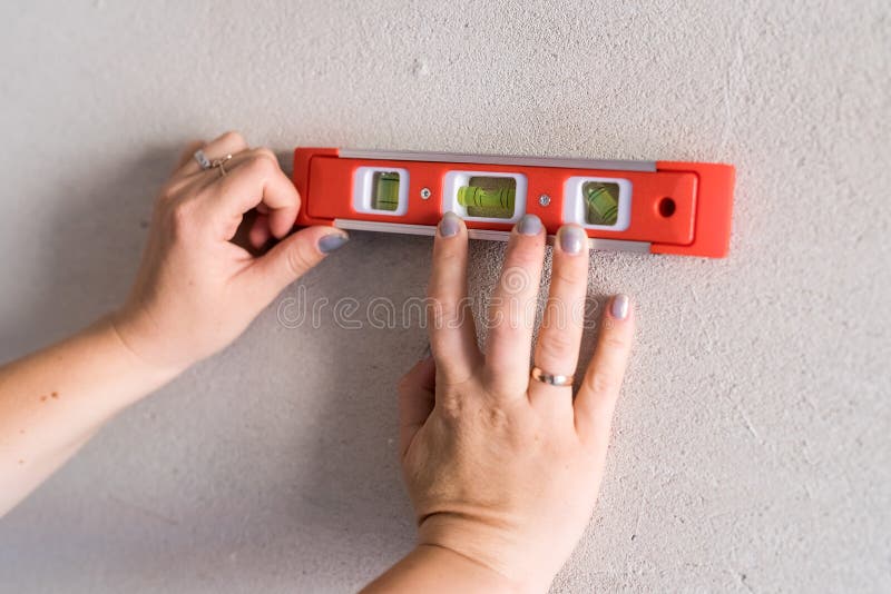 Female Hands with Water Level Instrument Close-up Stock Photo - Image ...