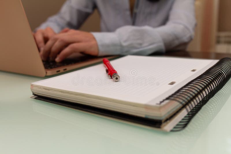 Female Hands Working on the Computer with a Red Pen and a Notebook ...
