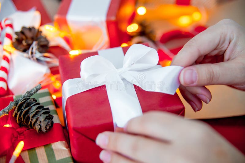 Female Hands Wrapping Red Christmas Gift Boxes Stock Photo - Image of ...