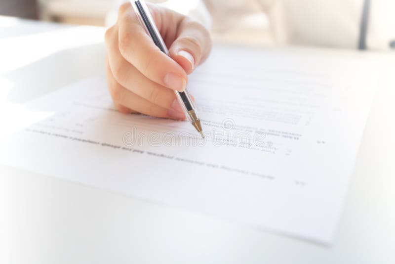 Female Hands Write with a Pen on a Sheet of Paper, Fill Out a ...