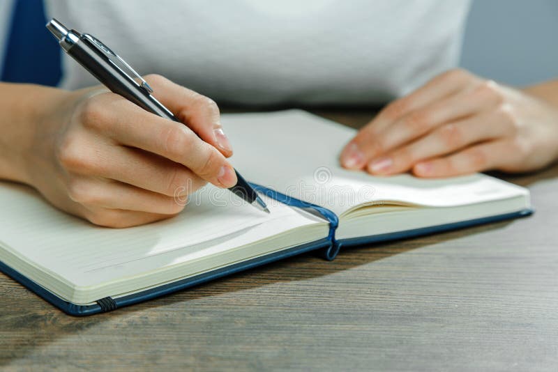 Female Hands are Writing in a Notebook Stock Image - Image of human ...