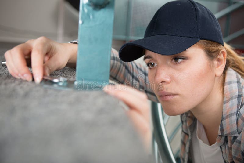 Female Handyman Using Wrench Stock Image - Image of maintenance ...