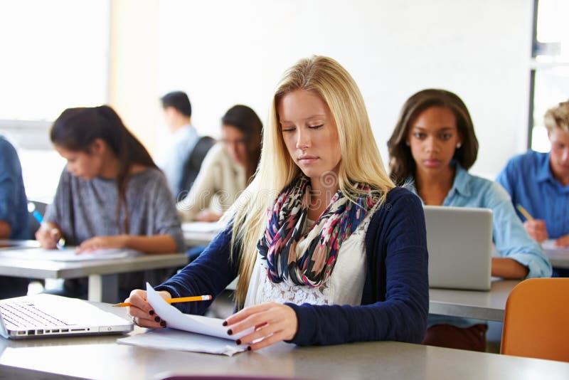 High School Student At Desk Stock Image - Image of academic, textbooks ...