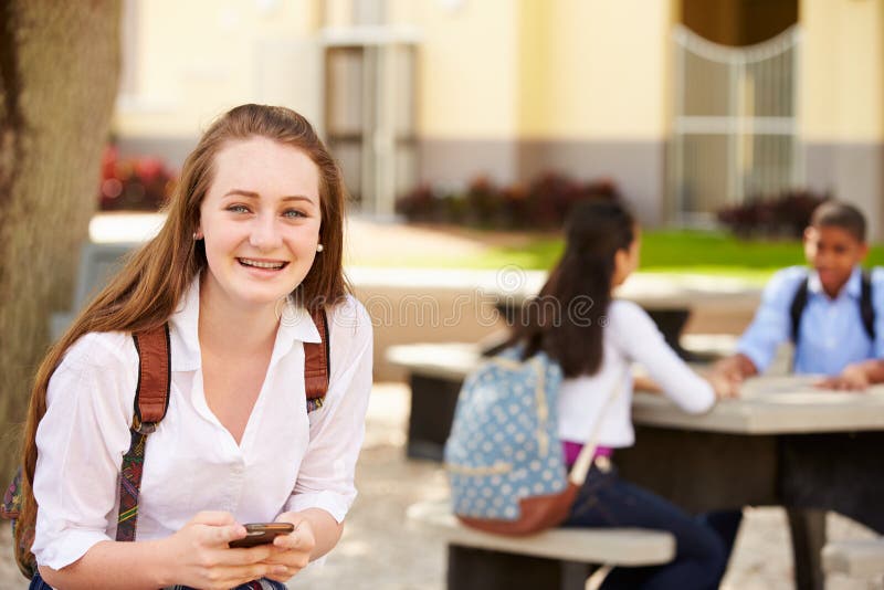 Male High School Student Using Phone on School Campus Stock Photo ...