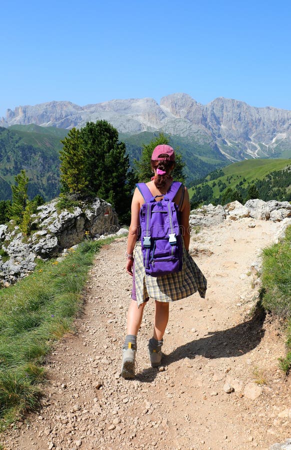 Female Hiker with Backpack Walking on Dirt Trail in Mountains Stock ...
