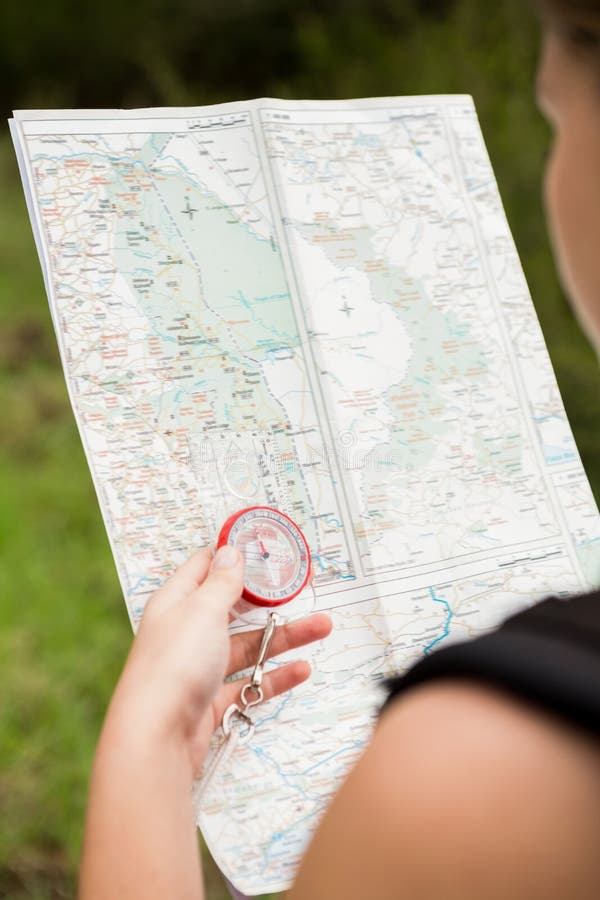 Female Hiker with Compass and Reading Map Stock Photo - Image of ...