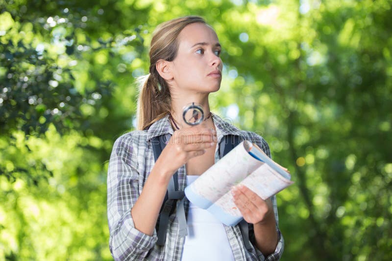 Female Hiker Looking at Map in Forest Stock Photo - Image of forest ...