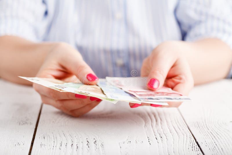 Female hold money in hands stock photo. Image of attractive - 110302968