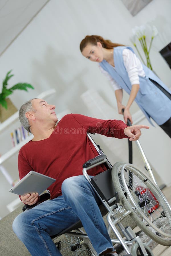 Female Home Helper with Disabled Mature Man Stock Photo - Image of ...