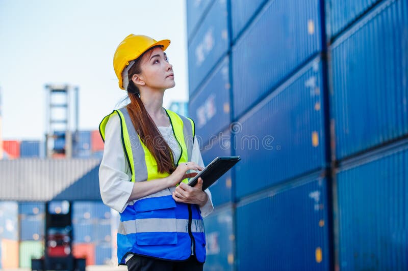 Female Industrial Engineer in Uniform Wearing Safety Hard Hat Using ...
