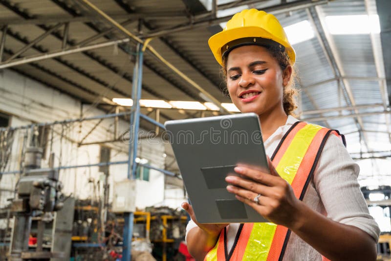 Female Industrial Worker Working and Checking Machine in a Large ...