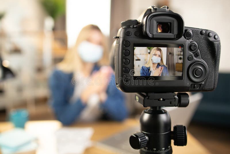 Female Influencer in Mask Using Camera for Leading Live Streaming Stock ...