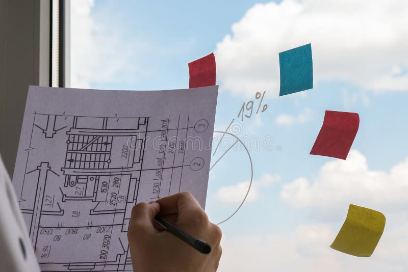 Female Interior Designer Drawing House Plan in Office. Workplace ...