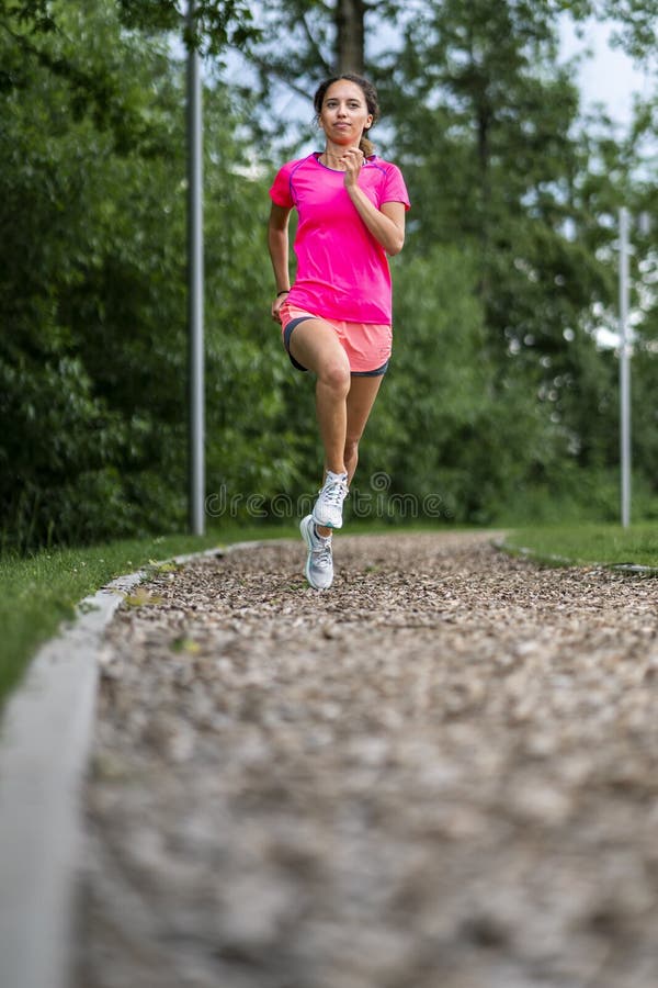 Female Jogger on a Track between Trees Stock Photo - Image of park ...