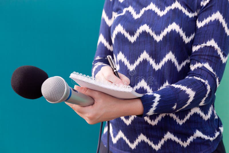 Female Journalist Taking Notes at Press Conference Stock Image - Image ...