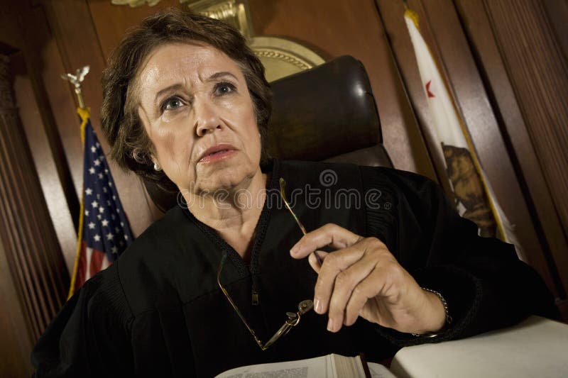 Female Judge Sitting in Courtroom Stock Photo - Image of legal, pensive ...