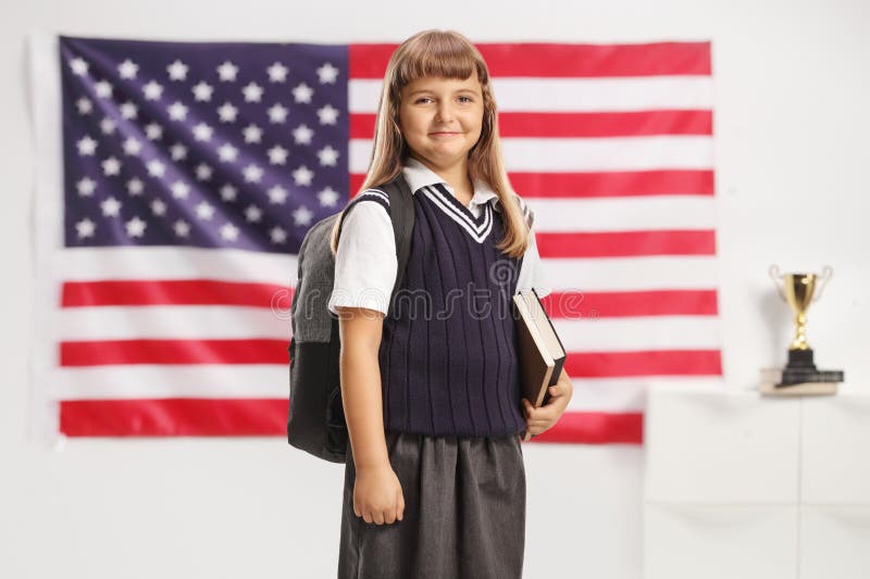 Female Junior Student Holding a Book and Smiling Stock Image - Image of ...