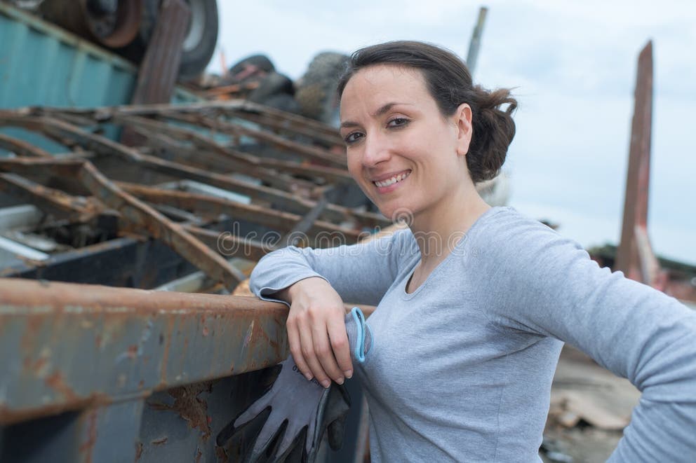 Female Junkyard Worker Posing and Smiling Stock Image - Image of ...