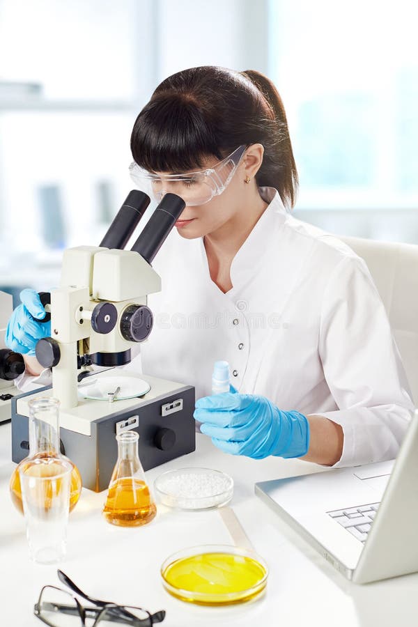 Female Lab Assistant Working with Chemicals Stock Photo - Image of look ...