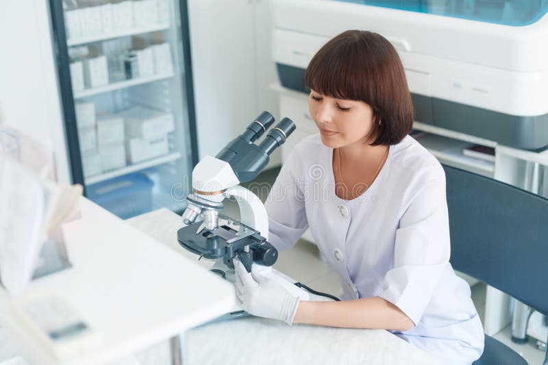 Female Lab Scientist Researcher Technician Worker in Gloves Sits Next ...