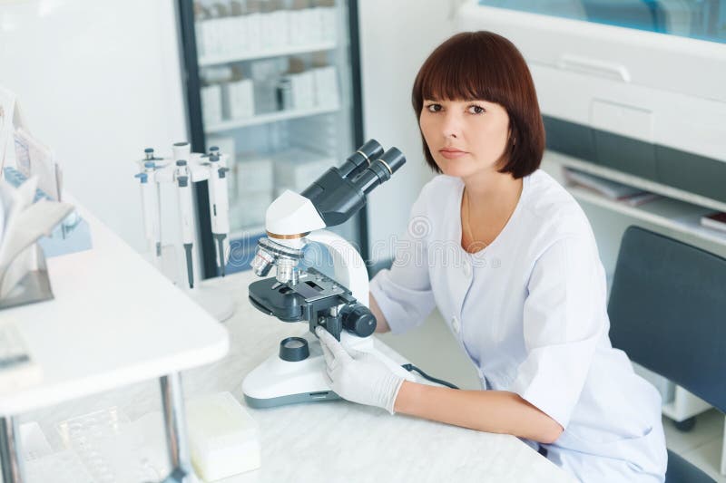 Female Lab Scientist Researcher Technician Worker in Gloves Sits Next ...
