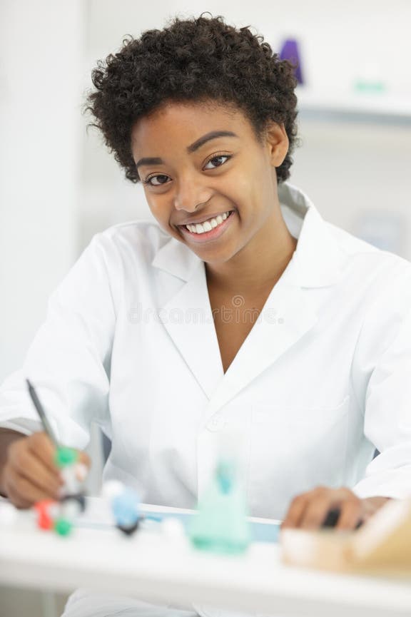 Female Lab Worker Smiling at Camera Stock Photo - Image of microscope ...