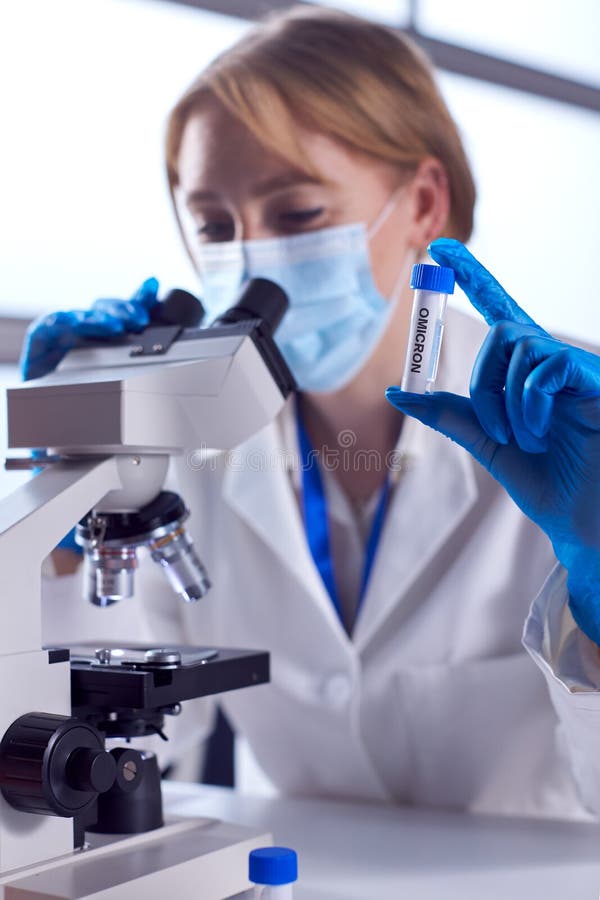 Female Lab Worker Wearing PPE Researching Covid-19 Omicron Variant in ...